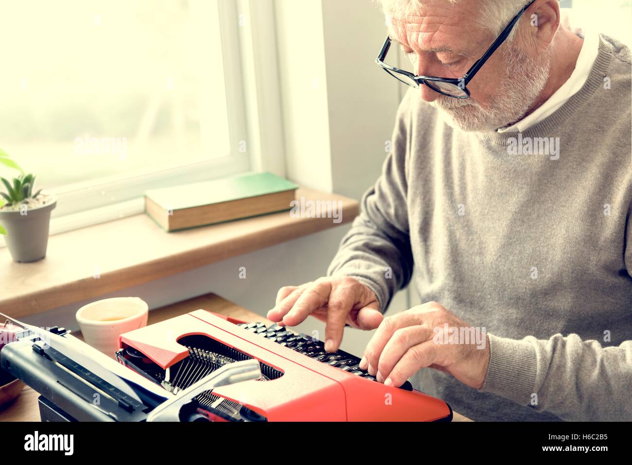 Senior Adult Typing Typerwriter Concept Stock Photo - Alamy