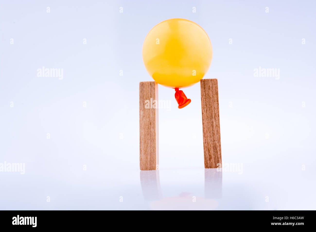 Balloon and domino pieces positioned on white background Stock Photo ...