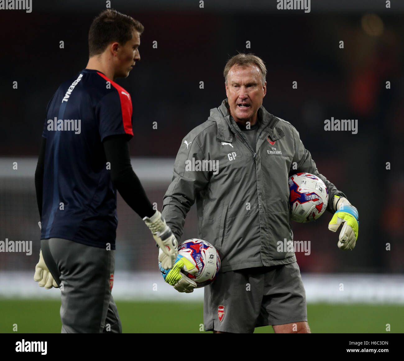 Arsenal goalkeeping coach Gerry Peyton (right) chats with goalkeeper ...