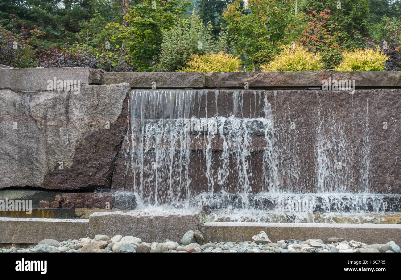 View of a fountain made up of rock walls and waterfalls Stock Photo - Alamy