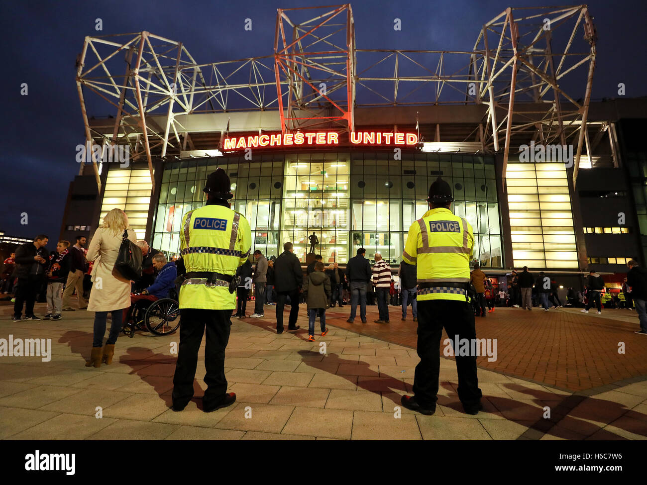 Police watch over fans outside ground hi-res stock photography and ...