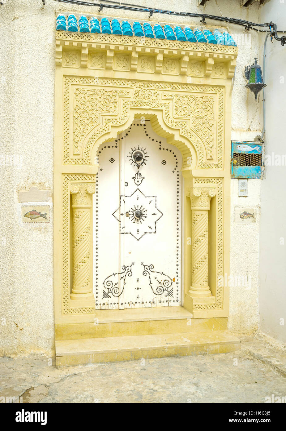 The beautiful traditional door frame made of carved plaster with the ...