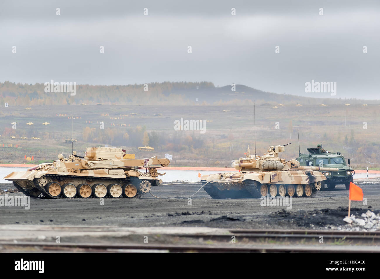 Armoured recovery vehicle BREM-1M evacuates tank Stock Photo - Alamy