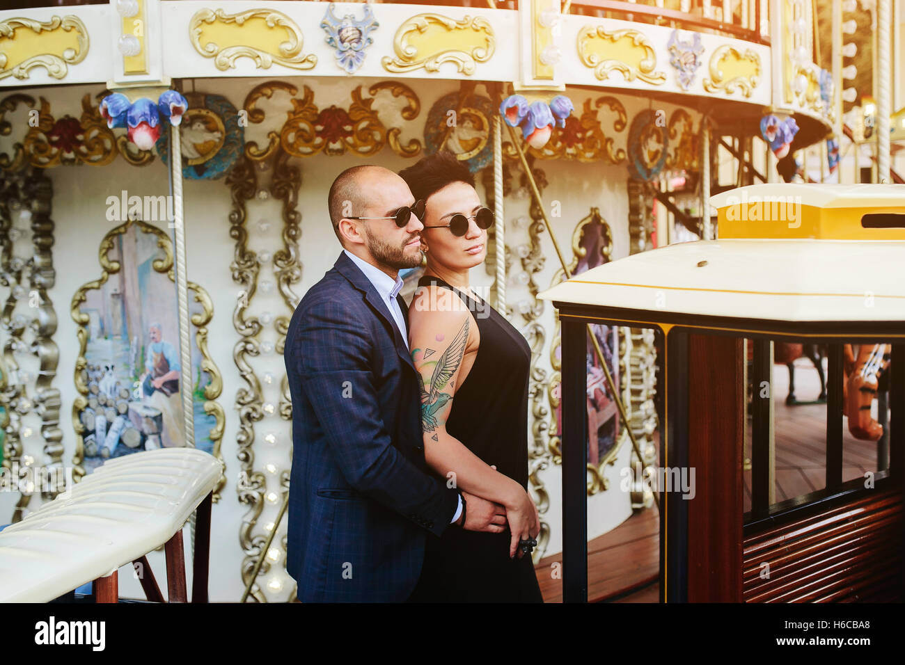 Adult man and woman on merry go round carousel hi-res stock photography ...