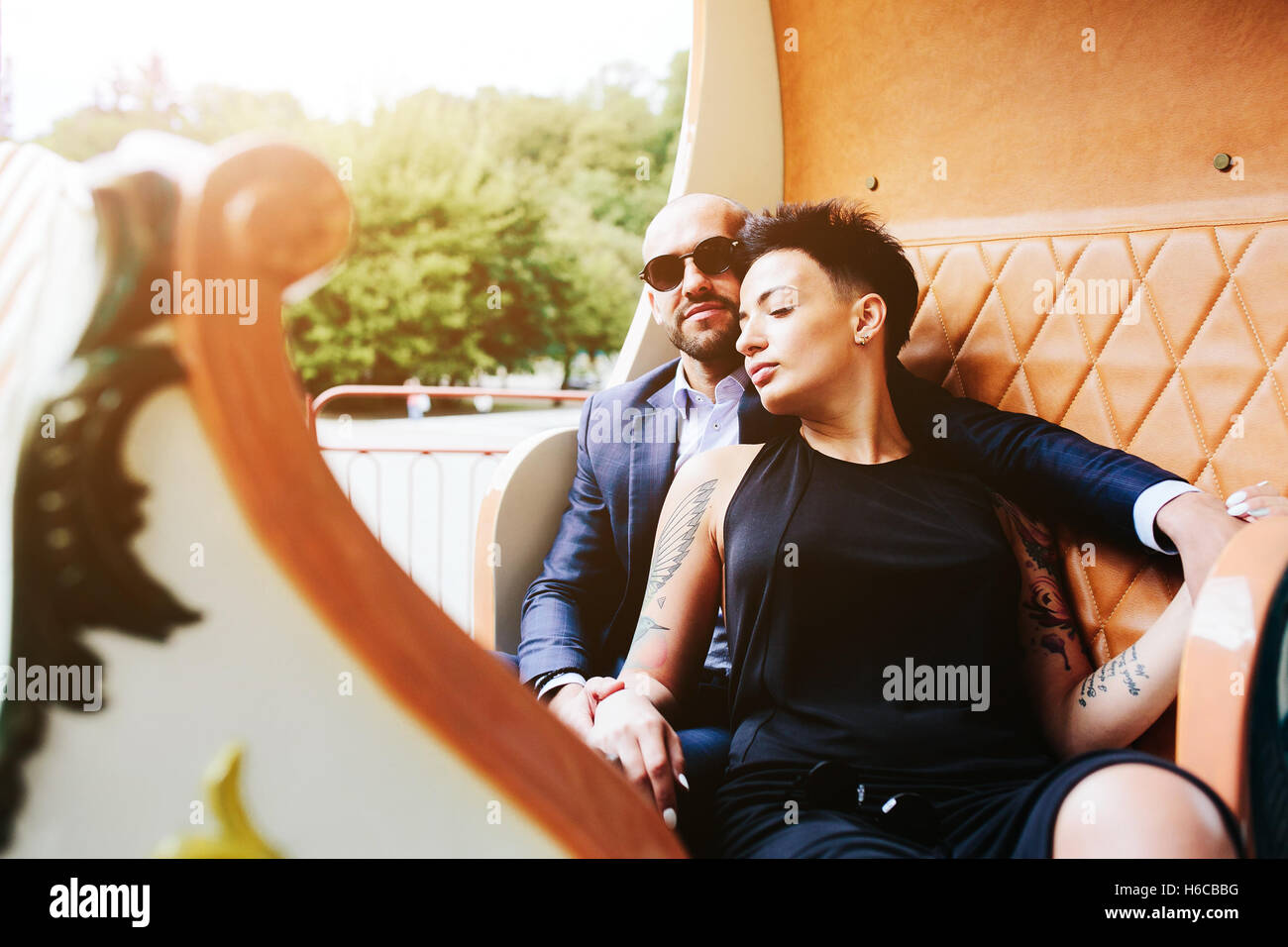 Young woman riding carousel hi-res stock photography and images - Alamy