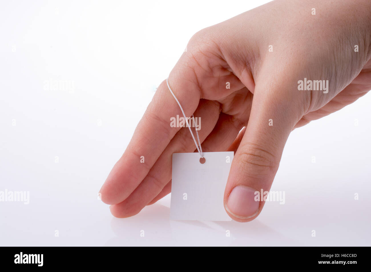 Hand holding a note paper with a holder on a white background Stock ...