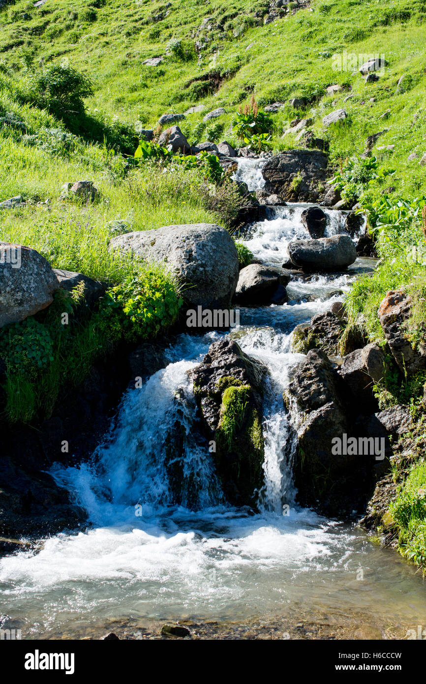 Landscape with river flowing through rocks Stock Photo - Alamy