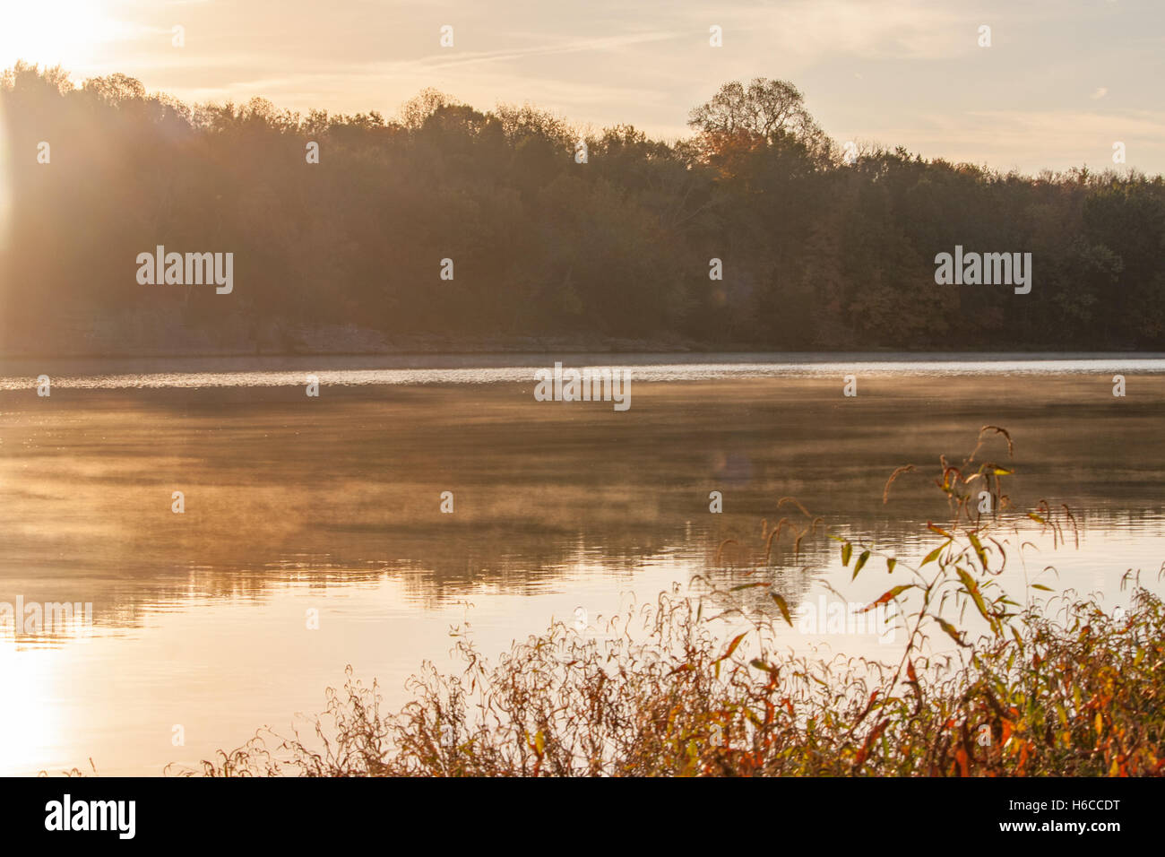 Sunrise over river Stock Photo - Alamy