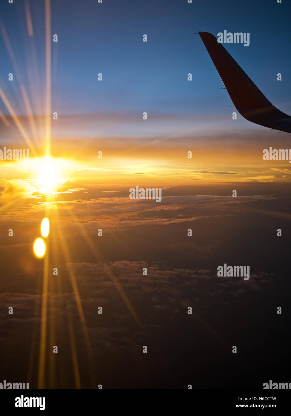 Sunset airplane altitude sky Stock Photo - Alamy