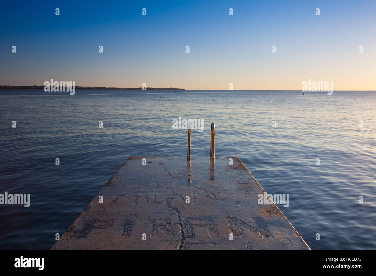 Lonely concrete dock city beach hi-res stock photography and images - Alamy