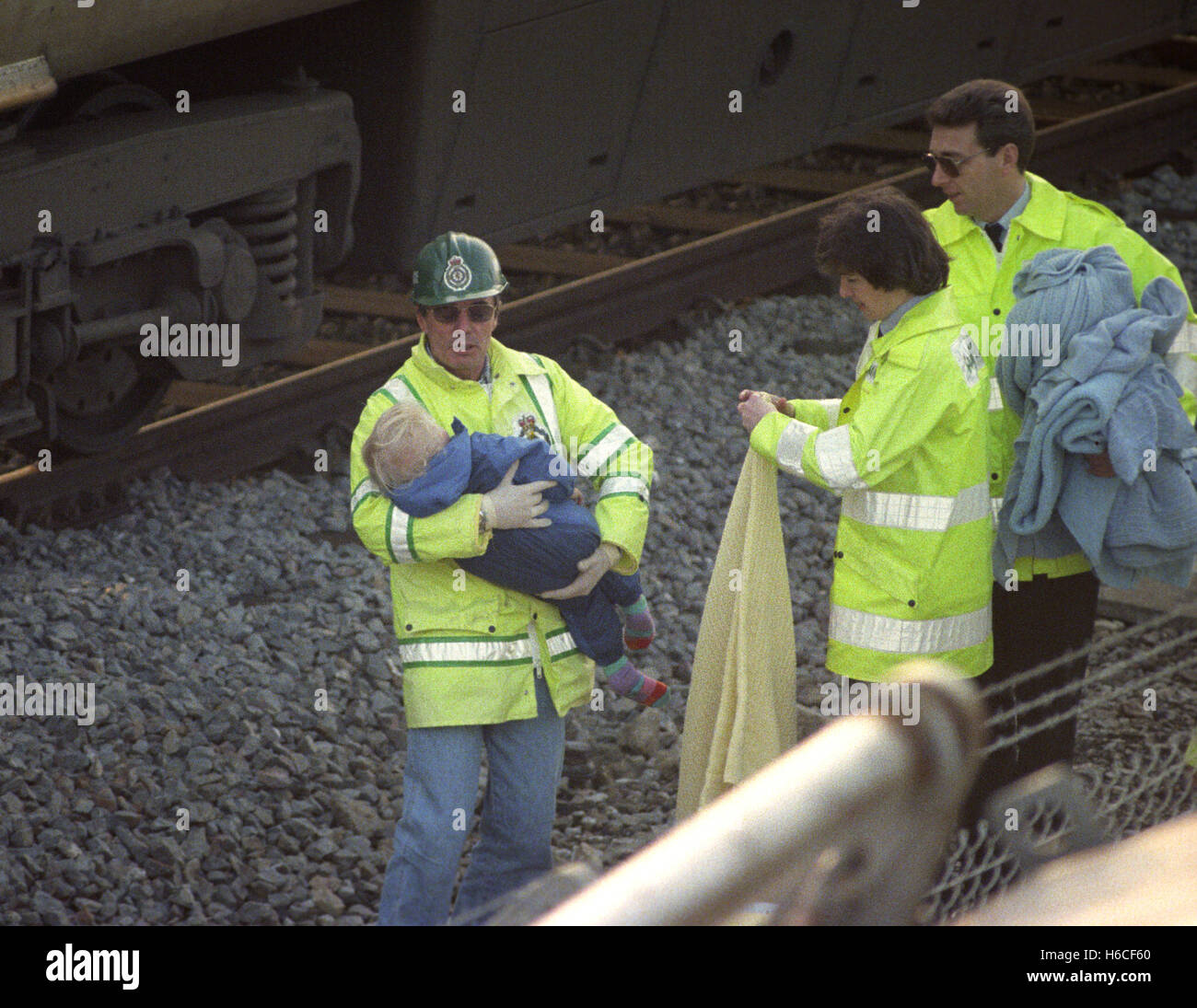 A young child is carried from the InterCity train on the Welsh side of ...