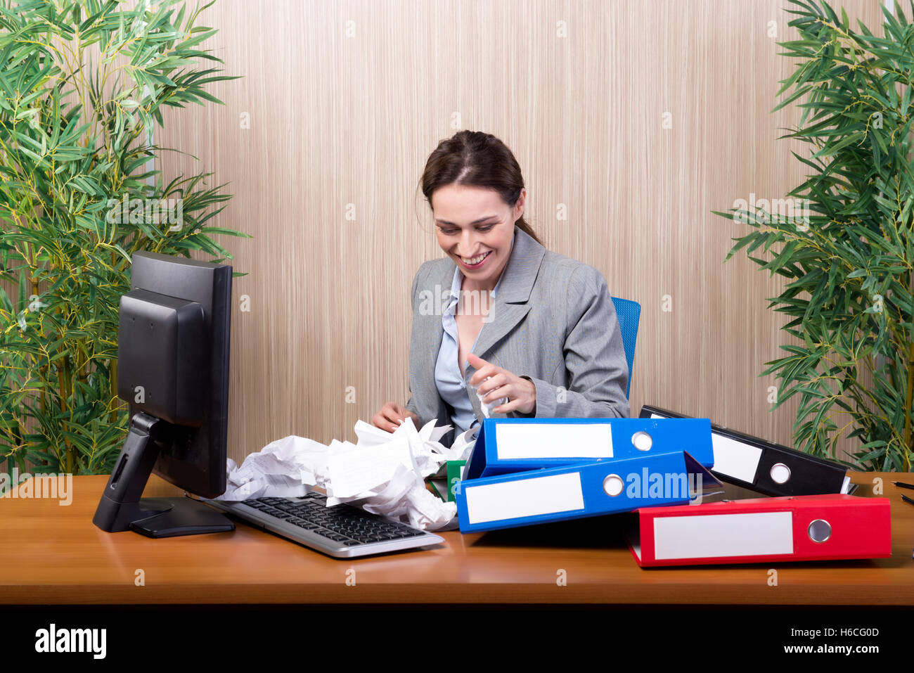 Busy businesswoman in the office under stress Stock Photo - Alamy