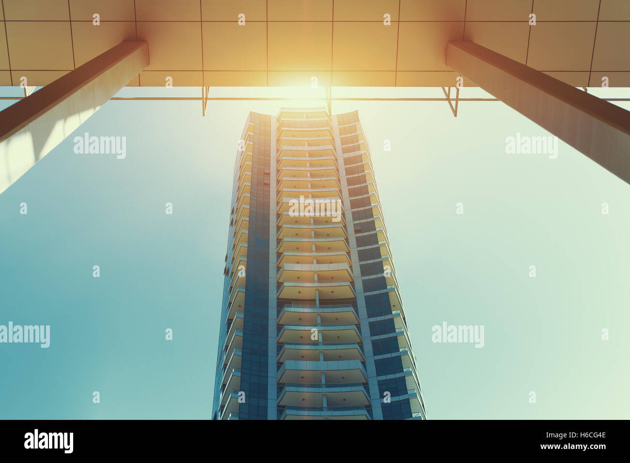 Centered modern skyscraper apartment building on a sunny day, with ...