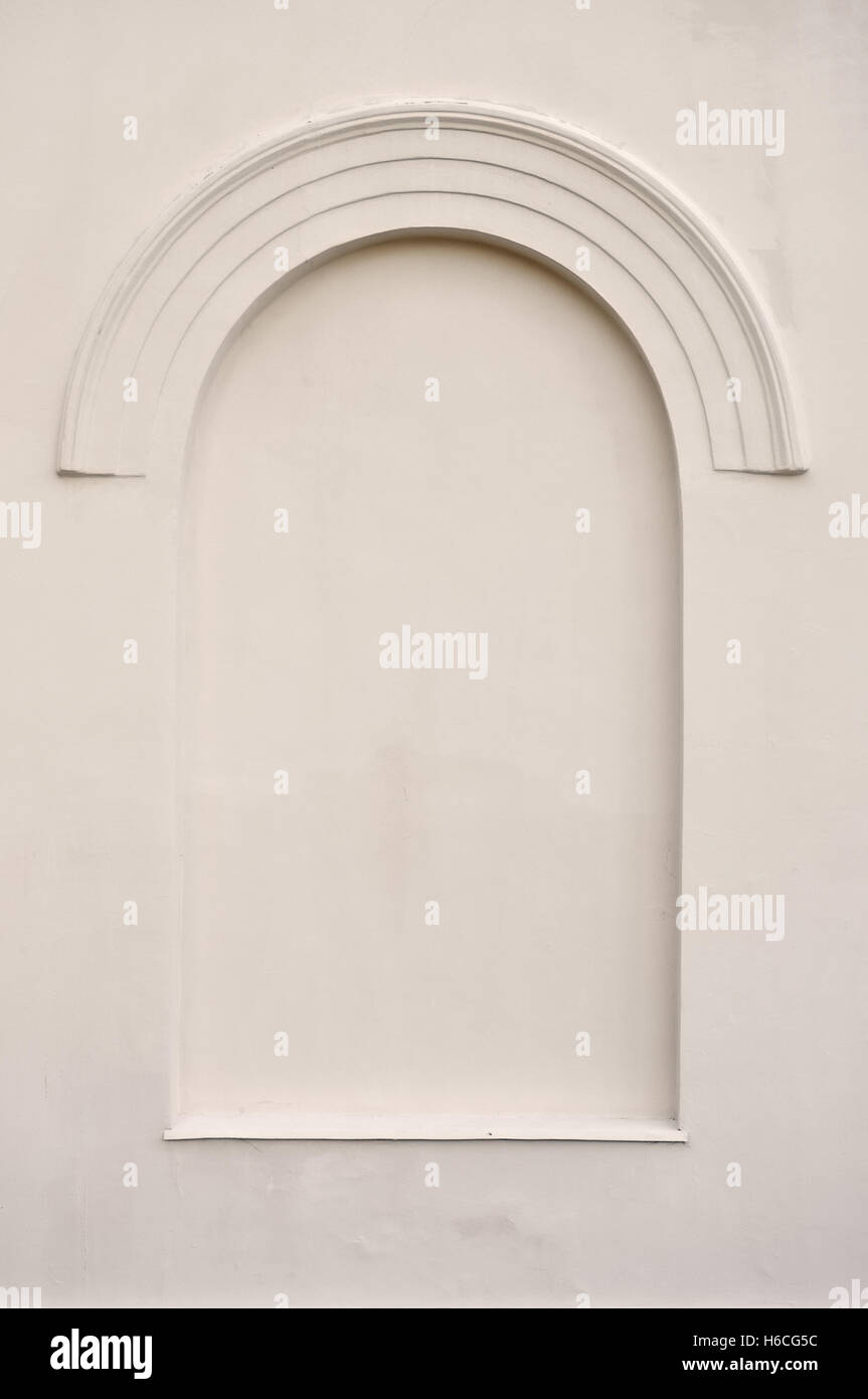 Old aged plastered faux arch false fake window stucco frame background ...