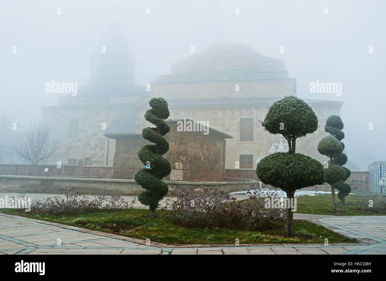 The beautiful trimmed trees in the small garden outside the Mevlana ...