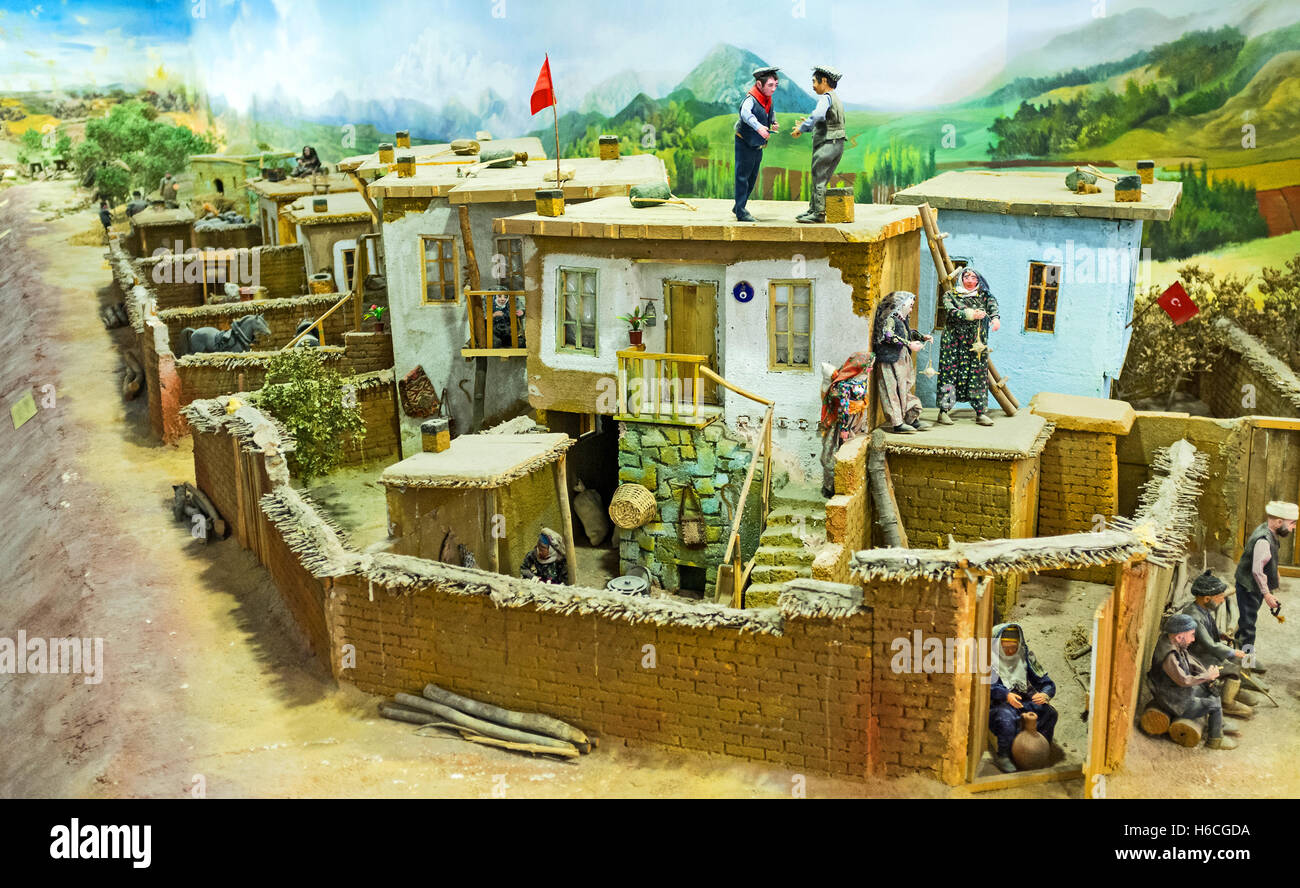 The diorama of the rural life with the miniature figures of people and ...