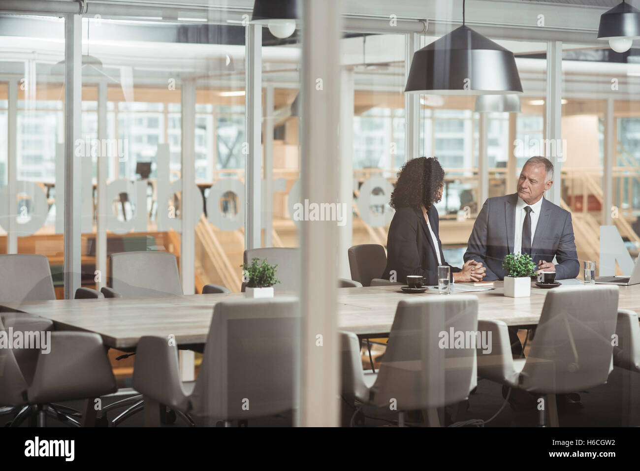 Talking business inside the company boardroom Stock Photo - Alamy