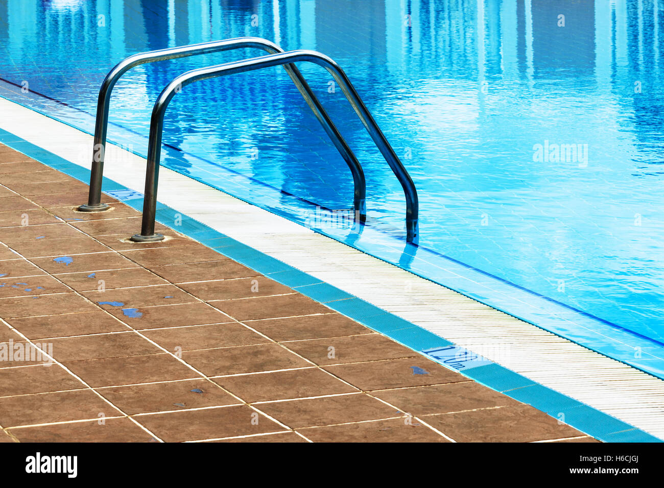 steel railings stairs pool with reflection Stock Photo - Alamy