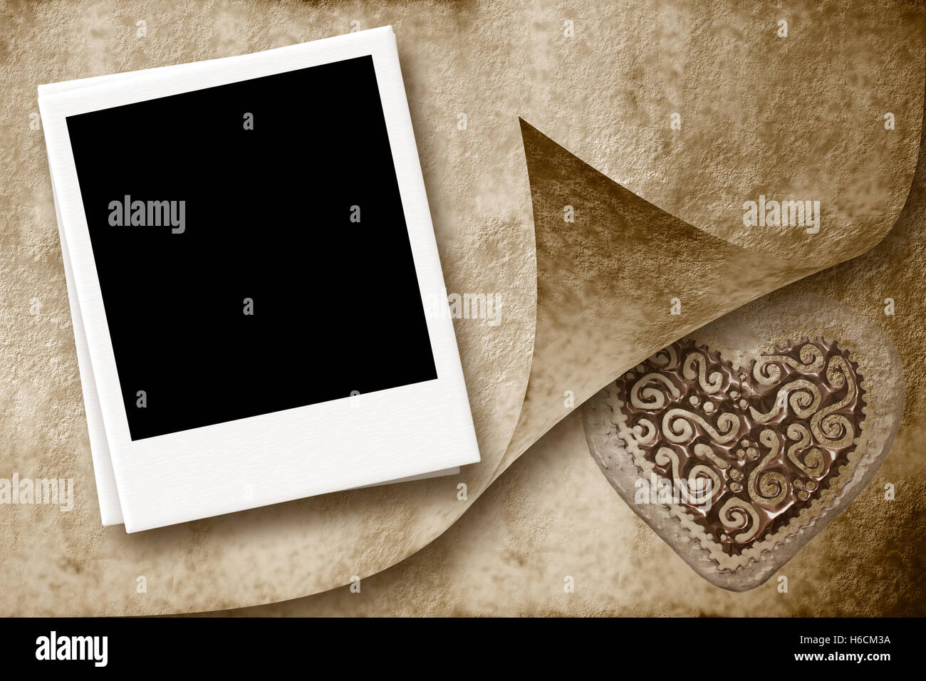 One instant empty photo frame on parchment paper background with a ...