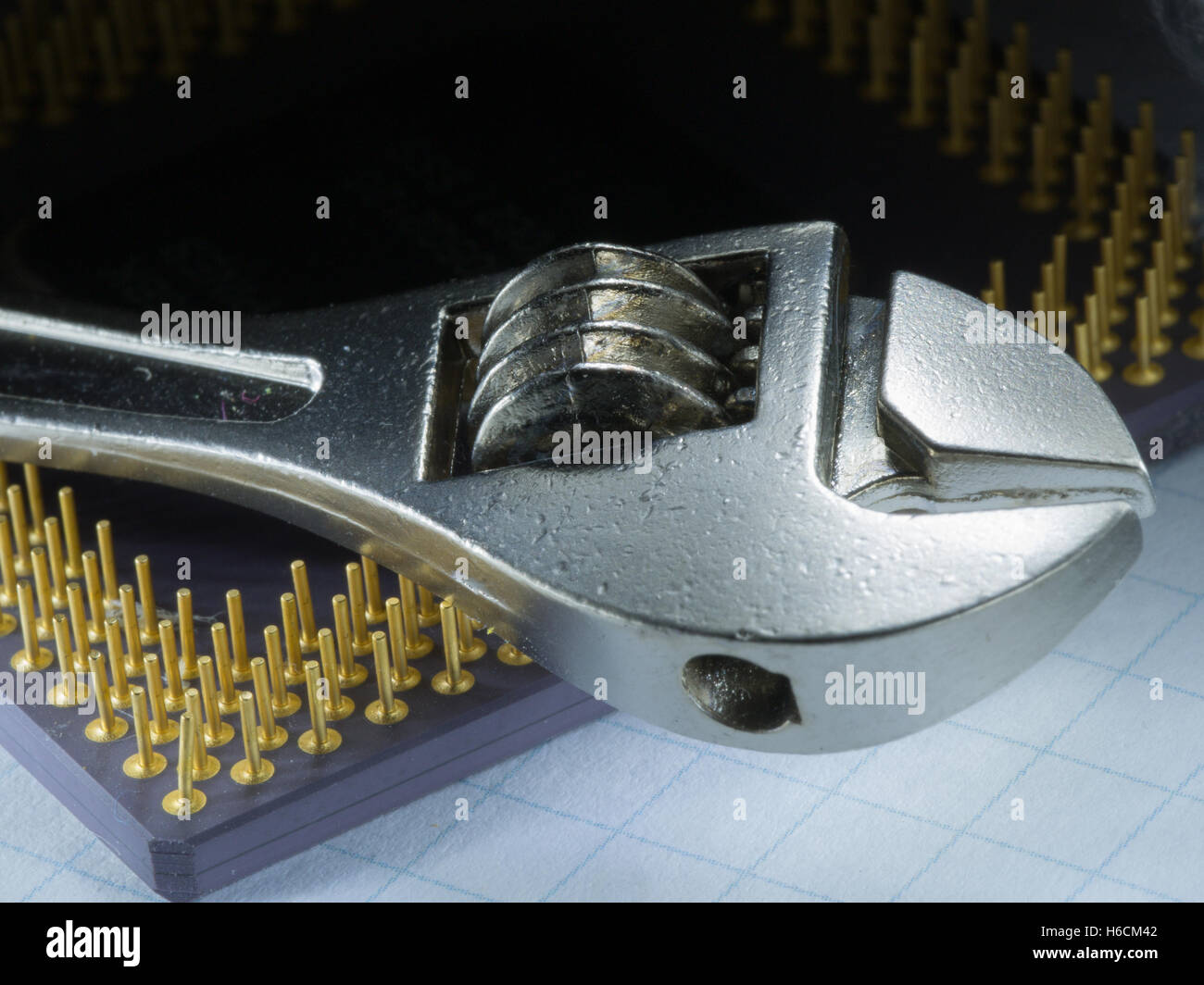 Adjustable wrench and the computer processor Stock Photo - Alamy