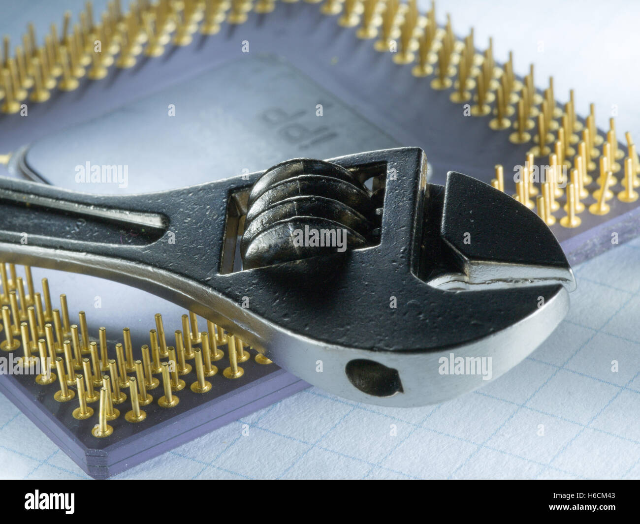 Adjustable wrench and the computer processor Stock Photo - Alamy