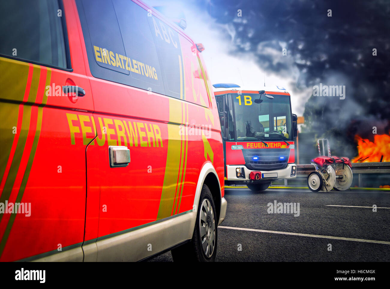 German firefighting trucks stands on a street near a fire Stock Photo ...