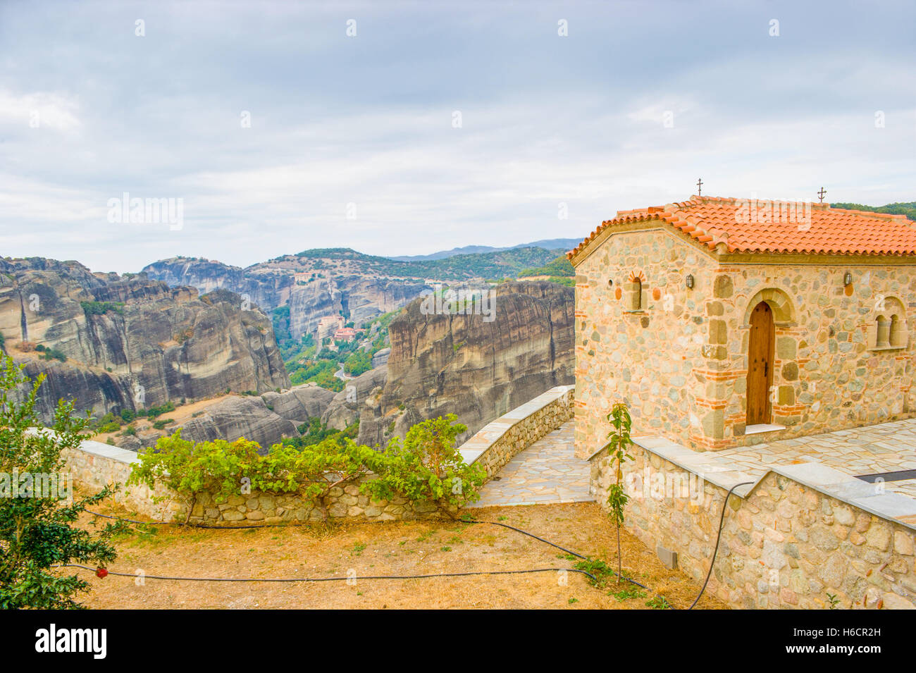 Monastery of the Holy Trinity with aerial view on the other cliffs and ...