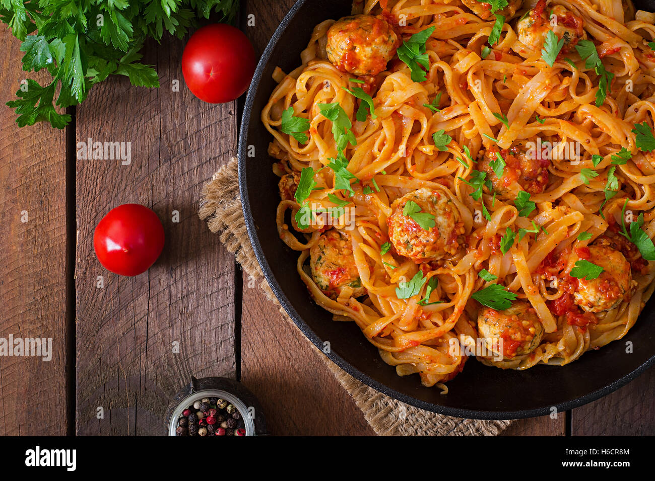Pasta linguine with meatballs in tomato sauce. Top view Stock Photo - Alamy