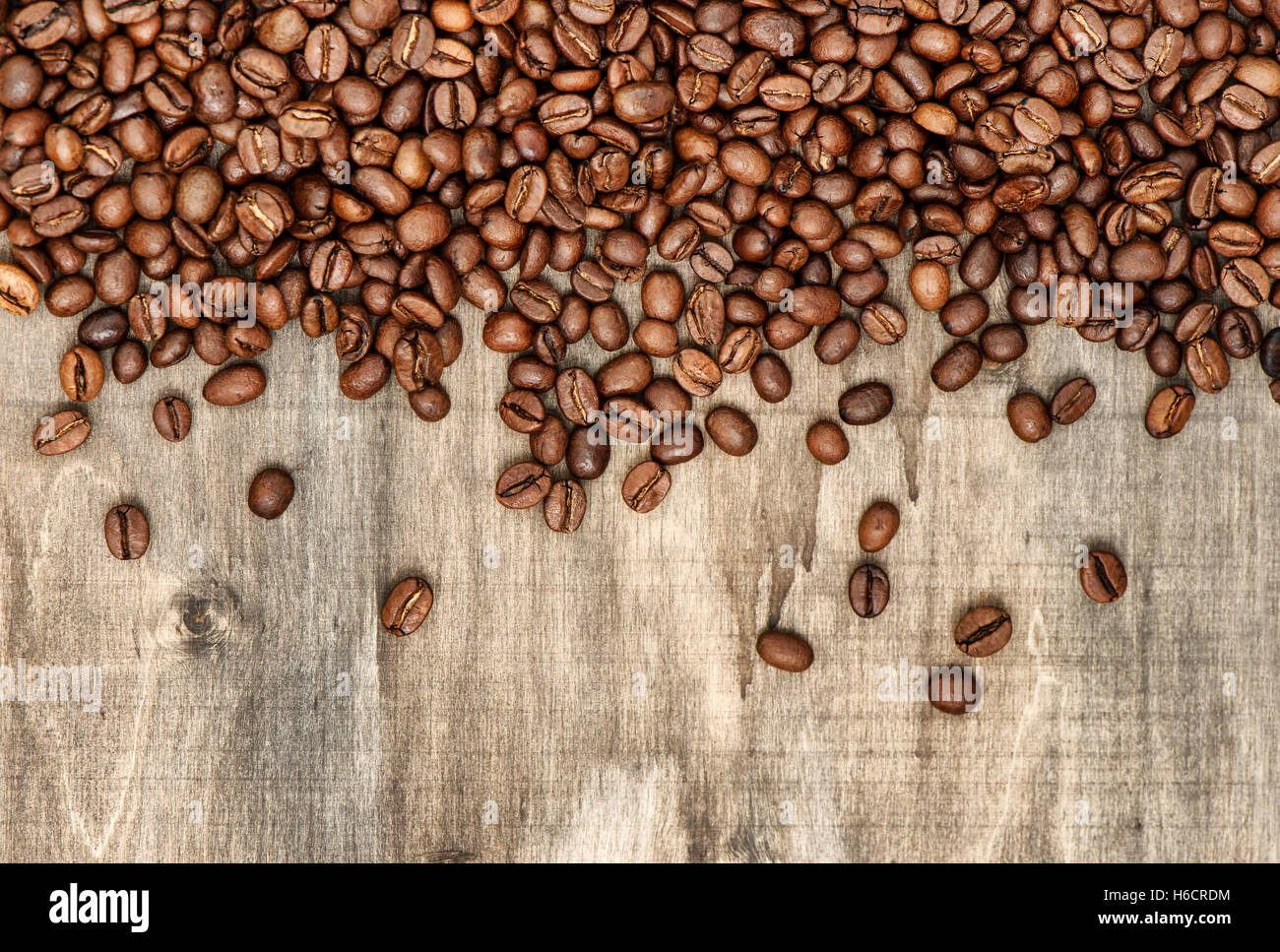 Coffee beans on rustic wooden background Stock Photo - Alamy