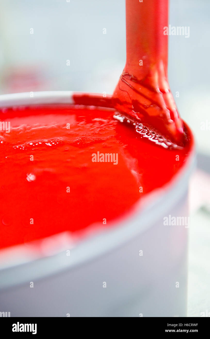 Red paint pot, printing colour Stock Photo - Alamy