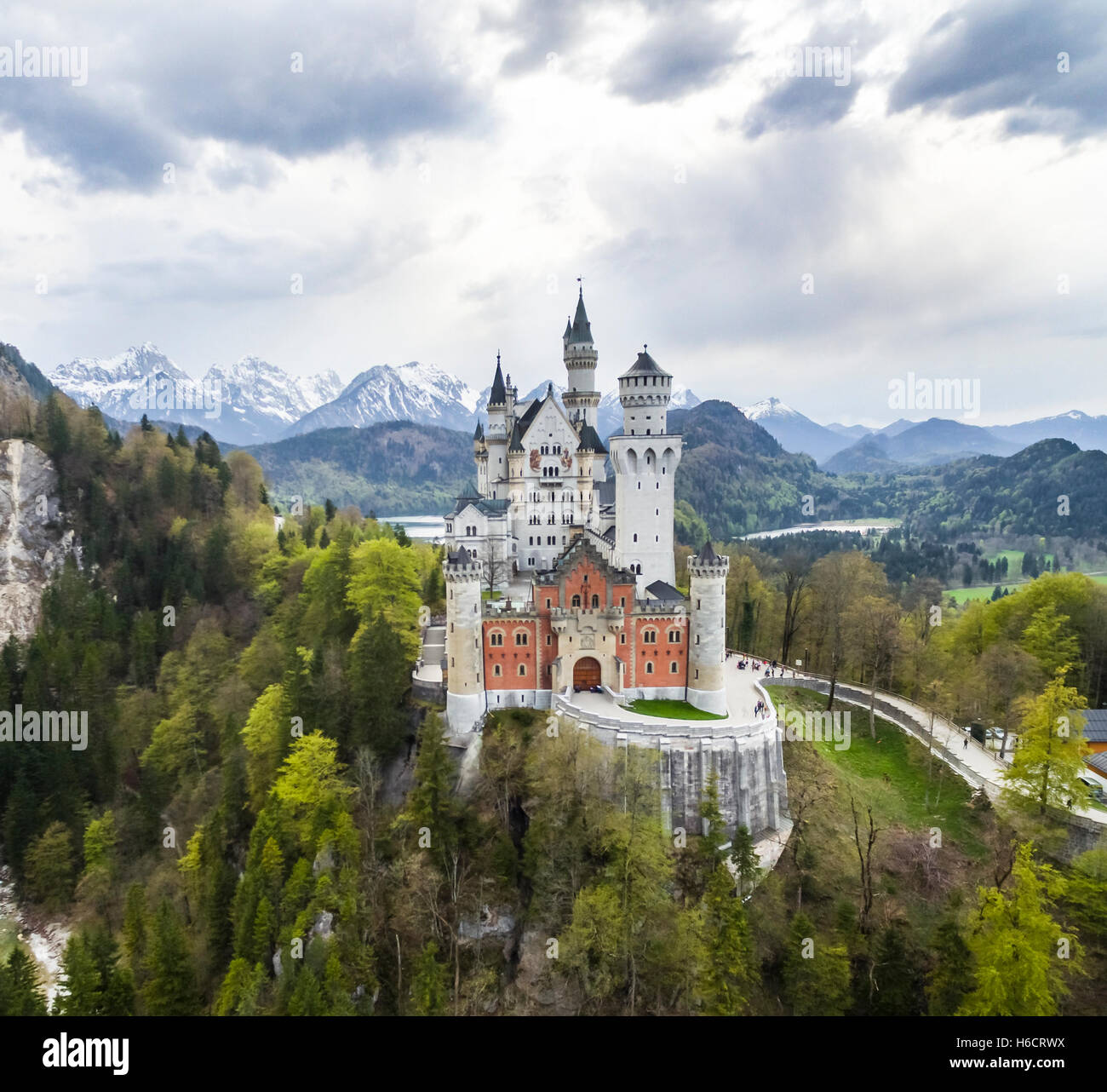 Aerial view of Neuschwanstein Castle with Lake Alpsee and Bavarian Alps ...