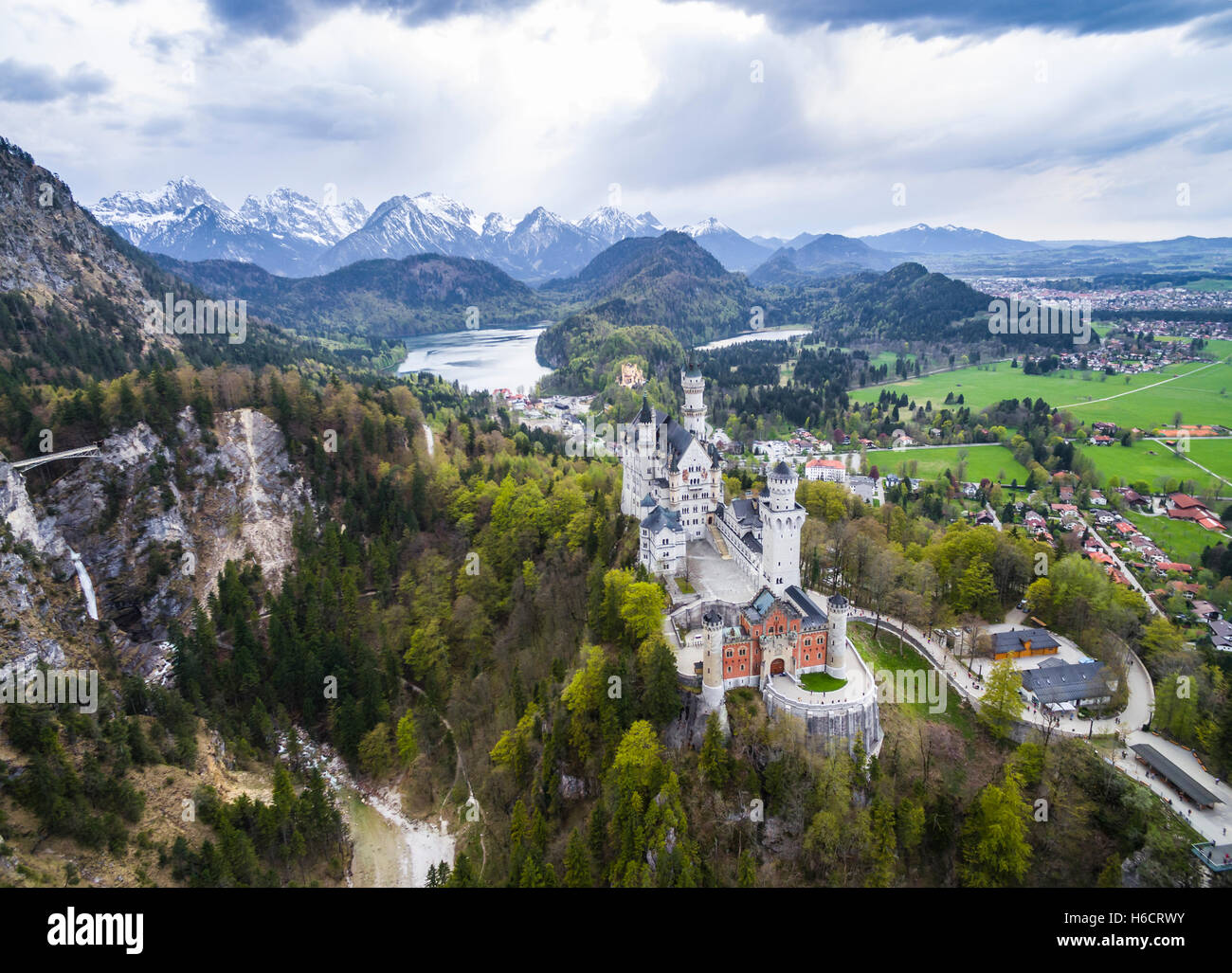 Aerial view of Neuschwanstein Castle with Lake Alpsee and Bavarian Alps ...