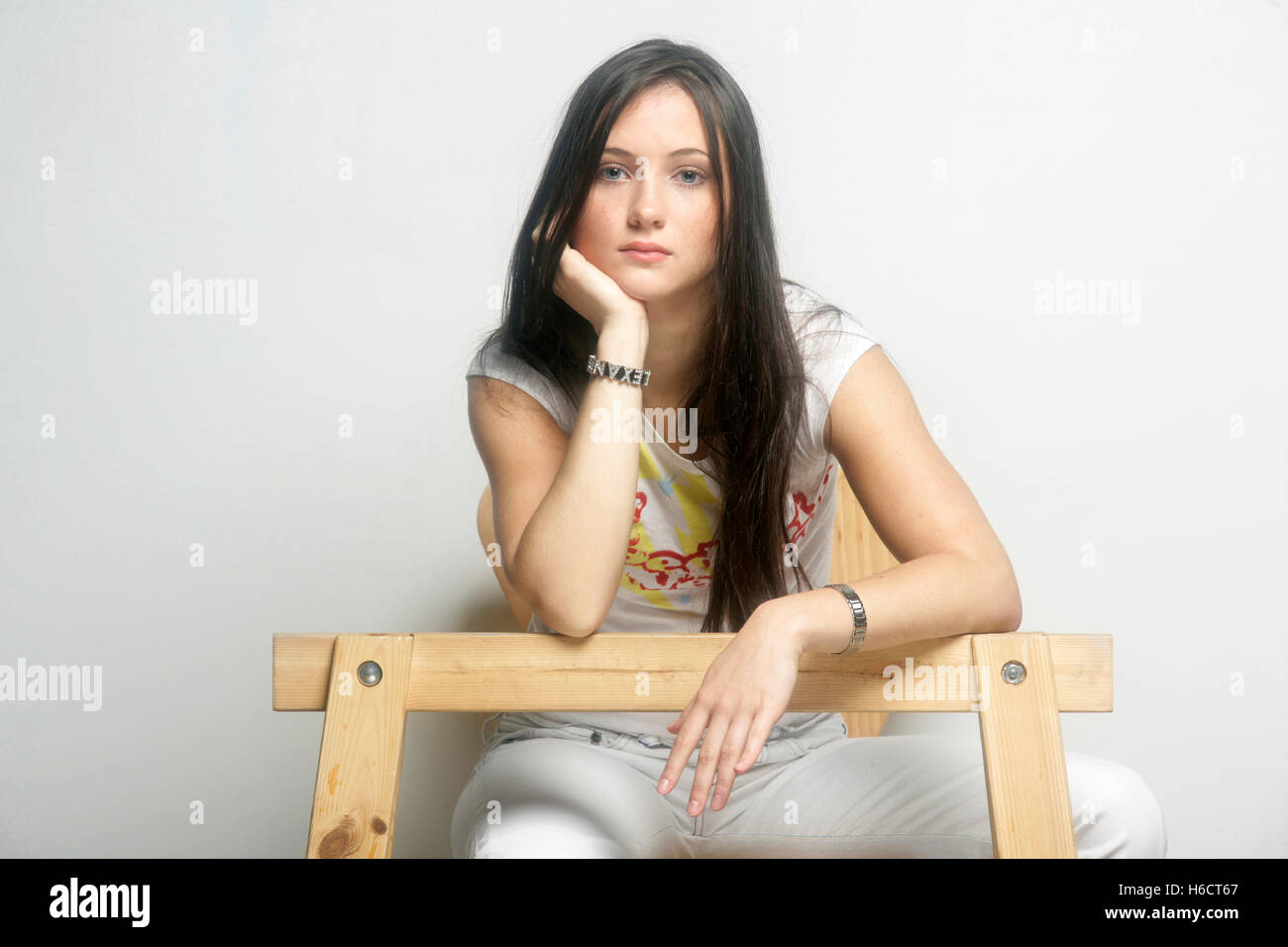 Young woman, seated Stock Photo - Alamy