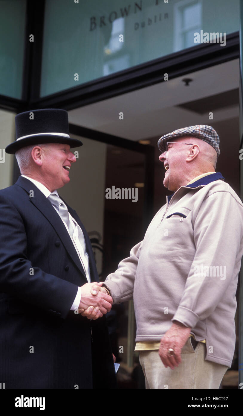 Porter and old men greeting each other in front of the Brown Thomas ...