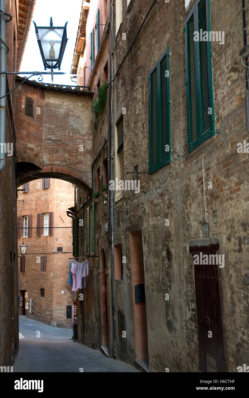 Alley in the historic town centre of Siena, Tuscany, Italy, Europe ...
