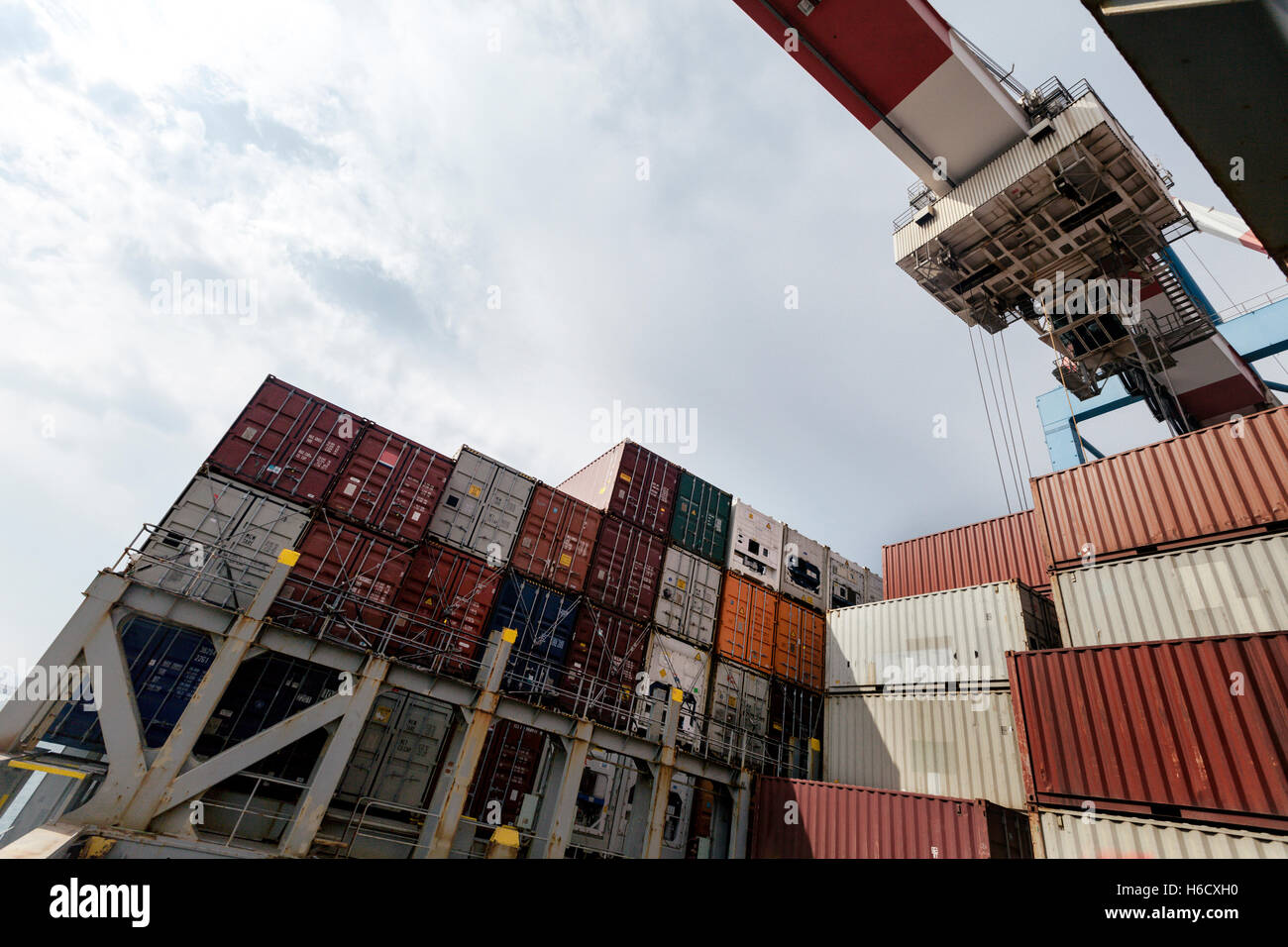 View of a freighter ship partially full with containers Stock Photo - Alamy