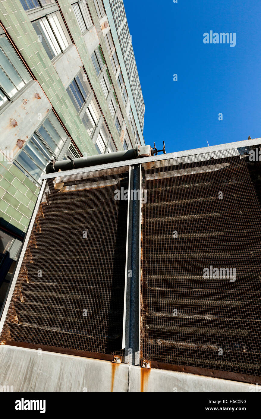 Wide angle view of an outdoor HVAC air conditioner unit located on a ...