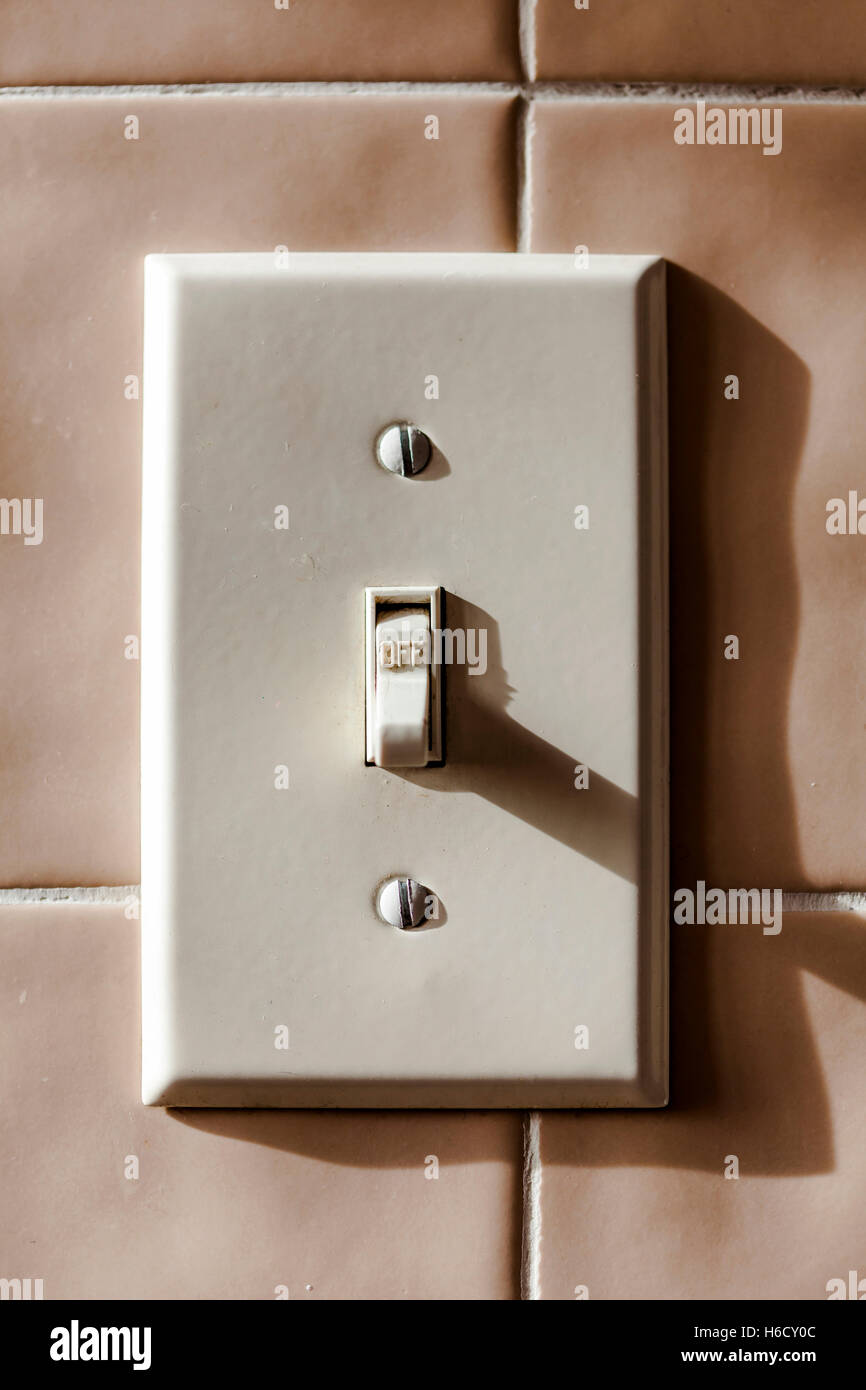 Light switch on tile ceramics wall turned off Stock Photo - Alamy