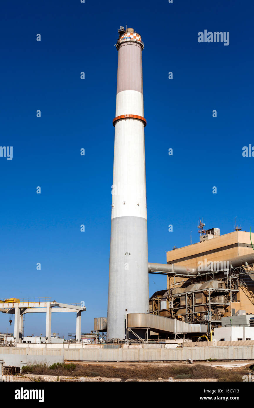 Fossil fuel power plant on a sunny day against clear sky Stock Photo ...