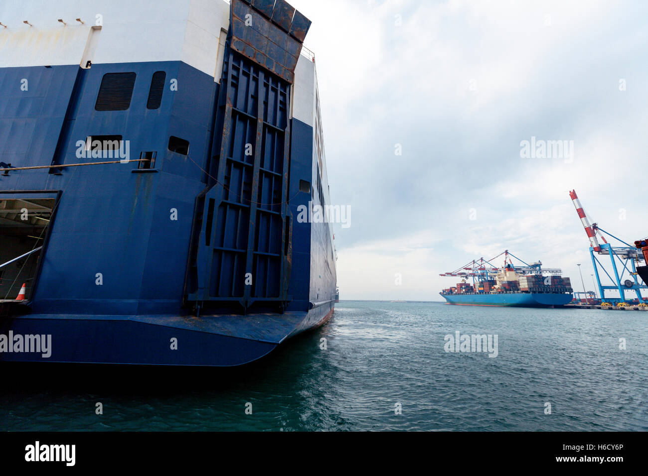 Docking freighter ships in a commercial harbor Stock Photo - Alamy