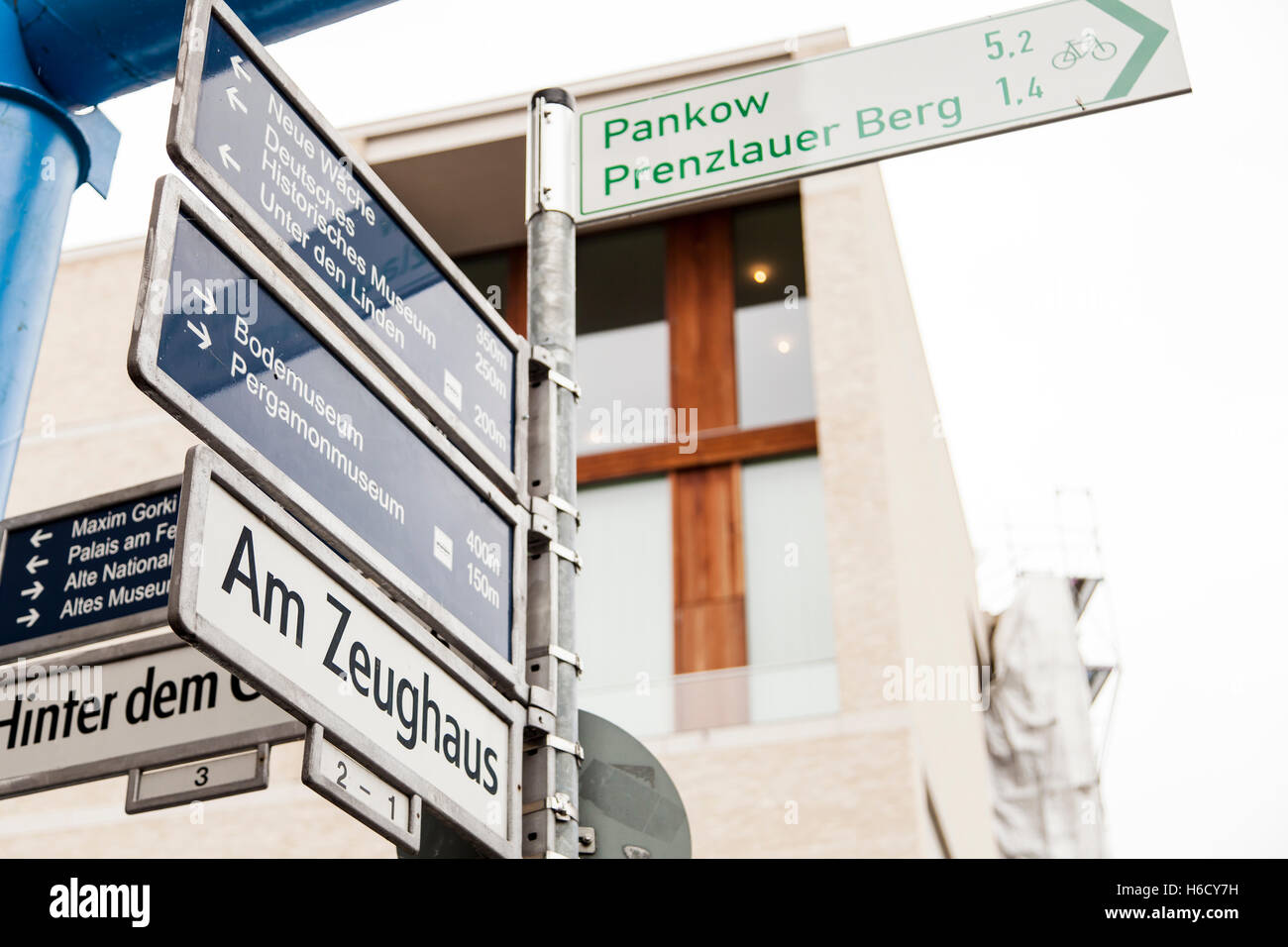 Street signs in an intersection depicting the direction and distance to ...