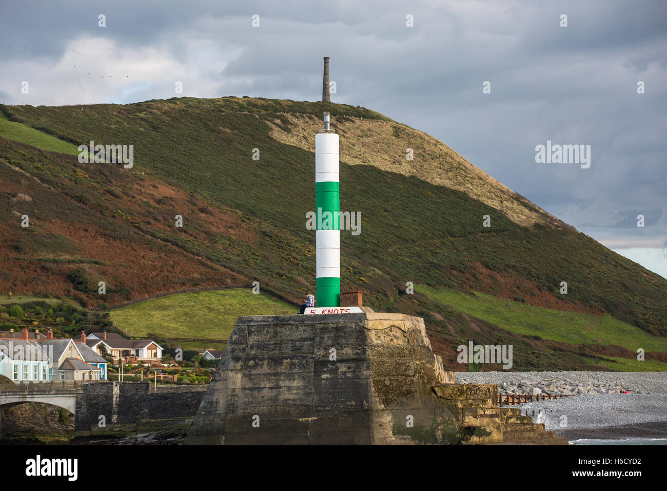 Aberystwyth sea break lighthouse on the entrance to the harbour with ...