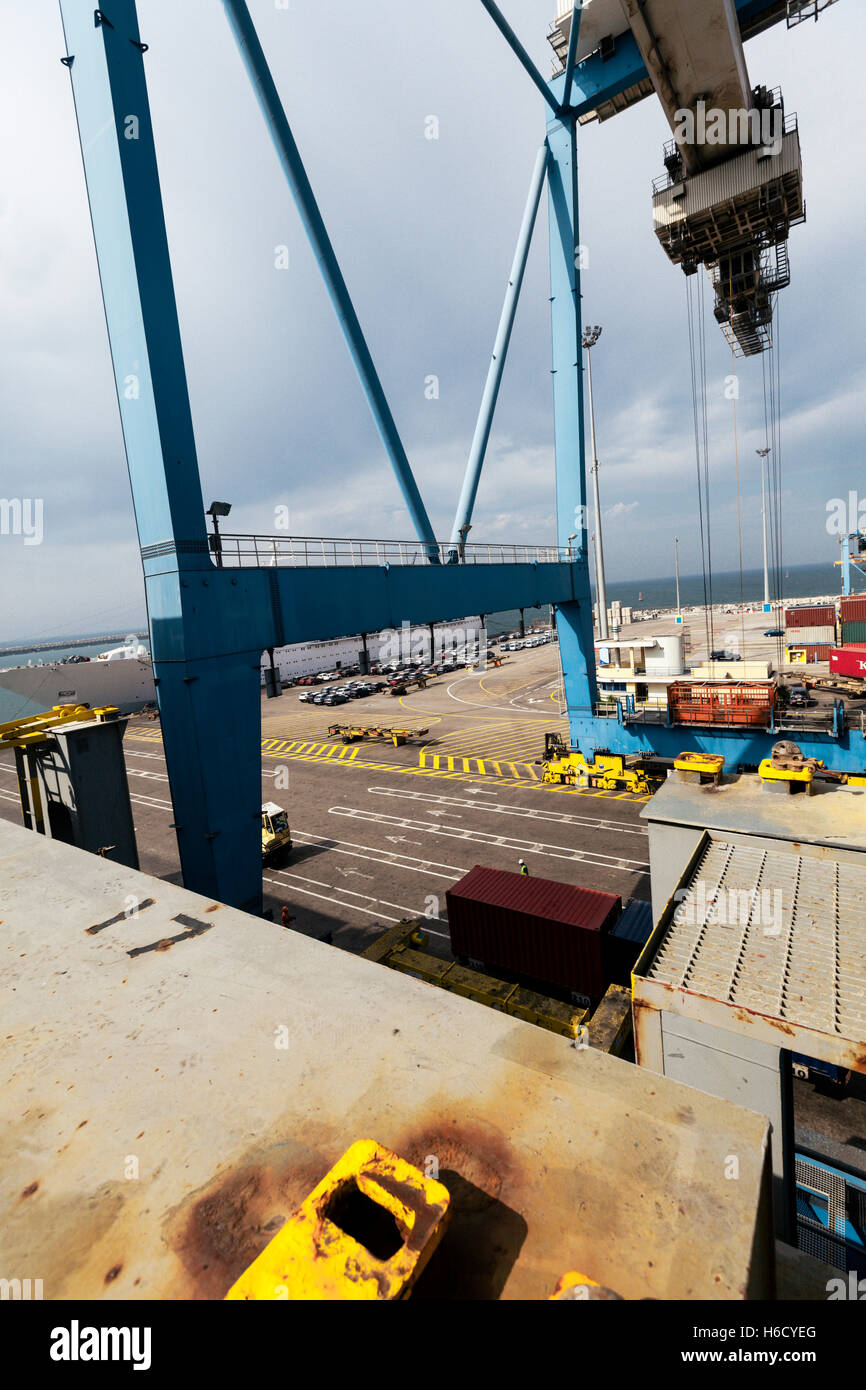 Commercial harbor dock and massive container crane as seen from a ...