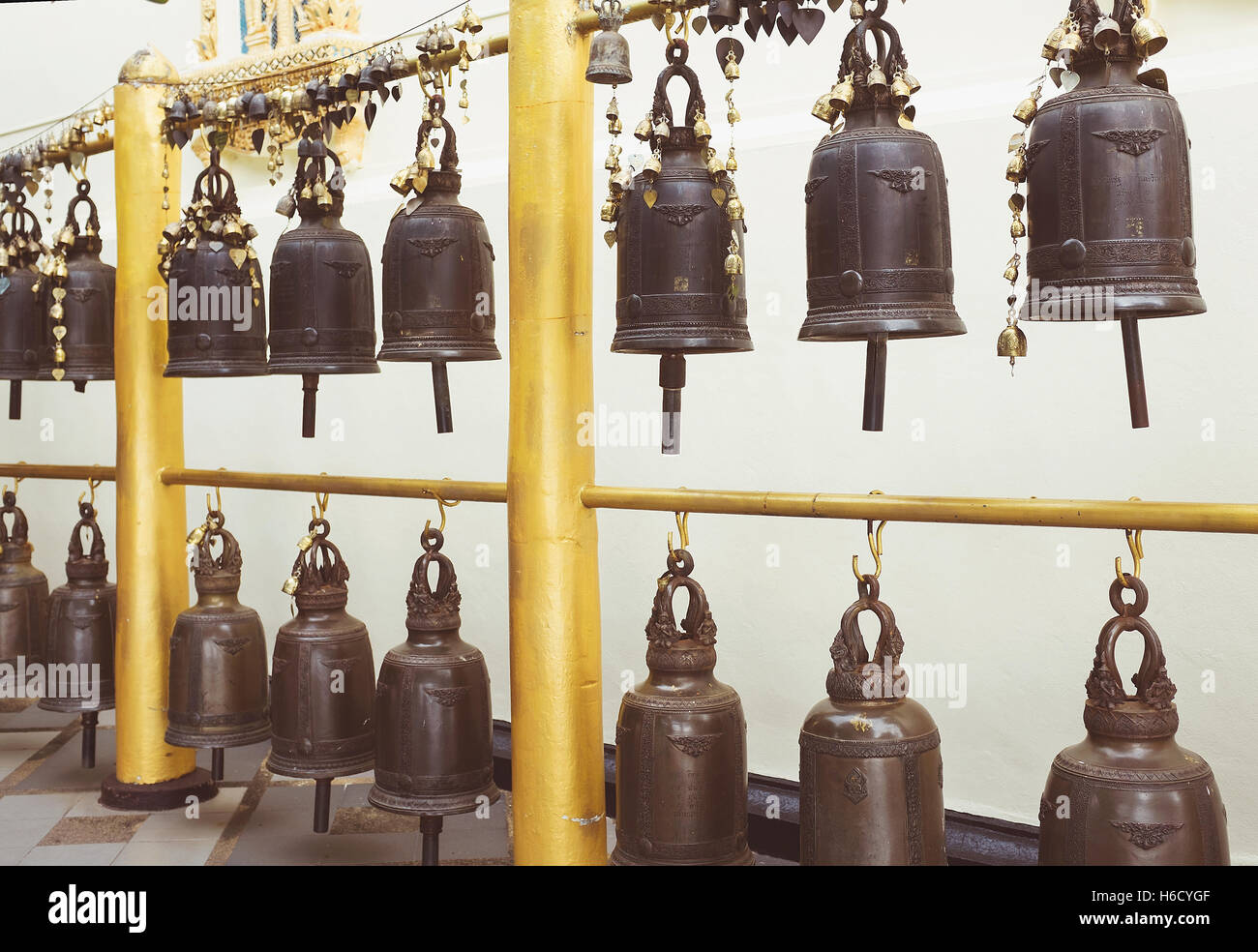 Buddhist prayer bells in Thai temple Stock Photo - Alamy