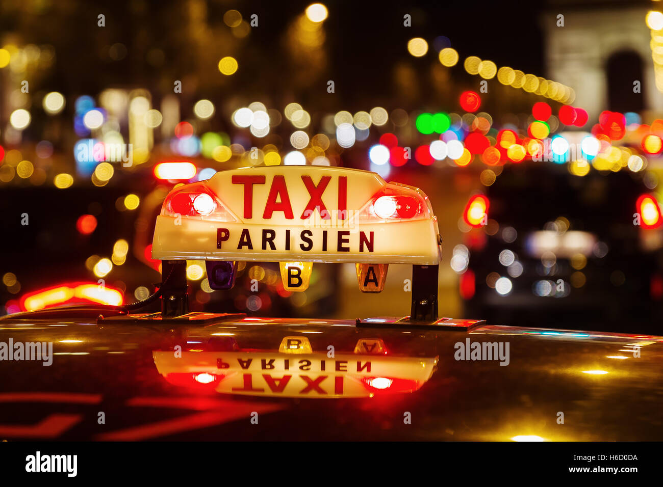neon sign of a Parisian taxi on the Champs-Elysees at night Stock Photo ...