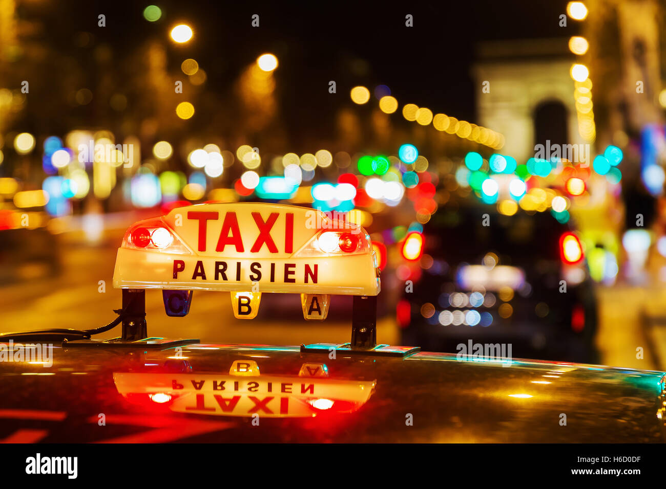 neon sign of a Parisian taxi on the Champs-Elysees at night Stock Photo ...