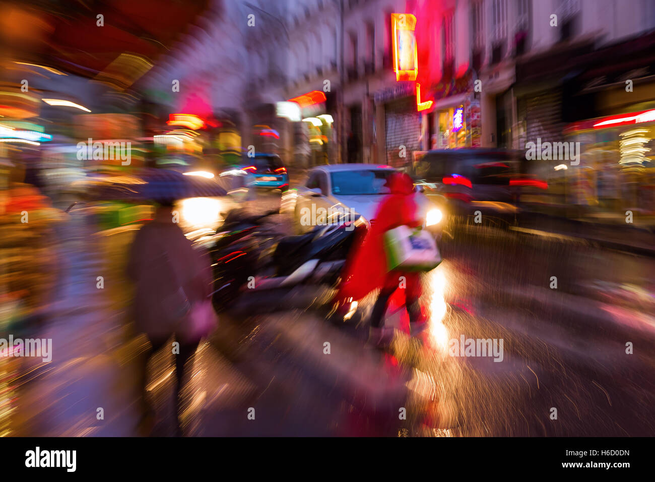 picture with camera made zoom effect of a traffic scene in the rainy ...