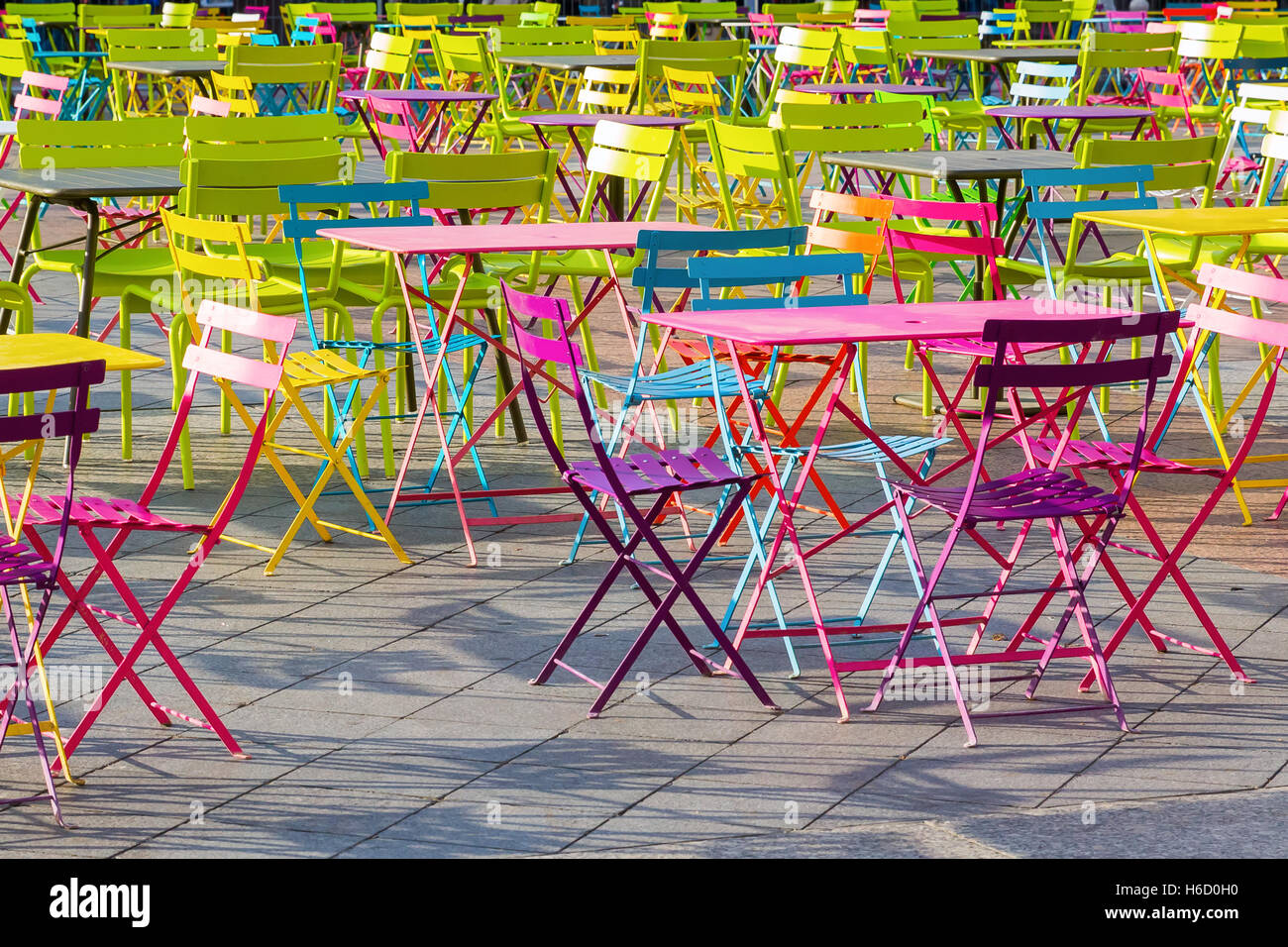 square filled with colorful coffee tables and chairs Stock Photo - Alamy