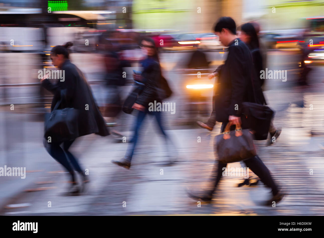 picture in motion blur of people crossing a city street at night Stock ...