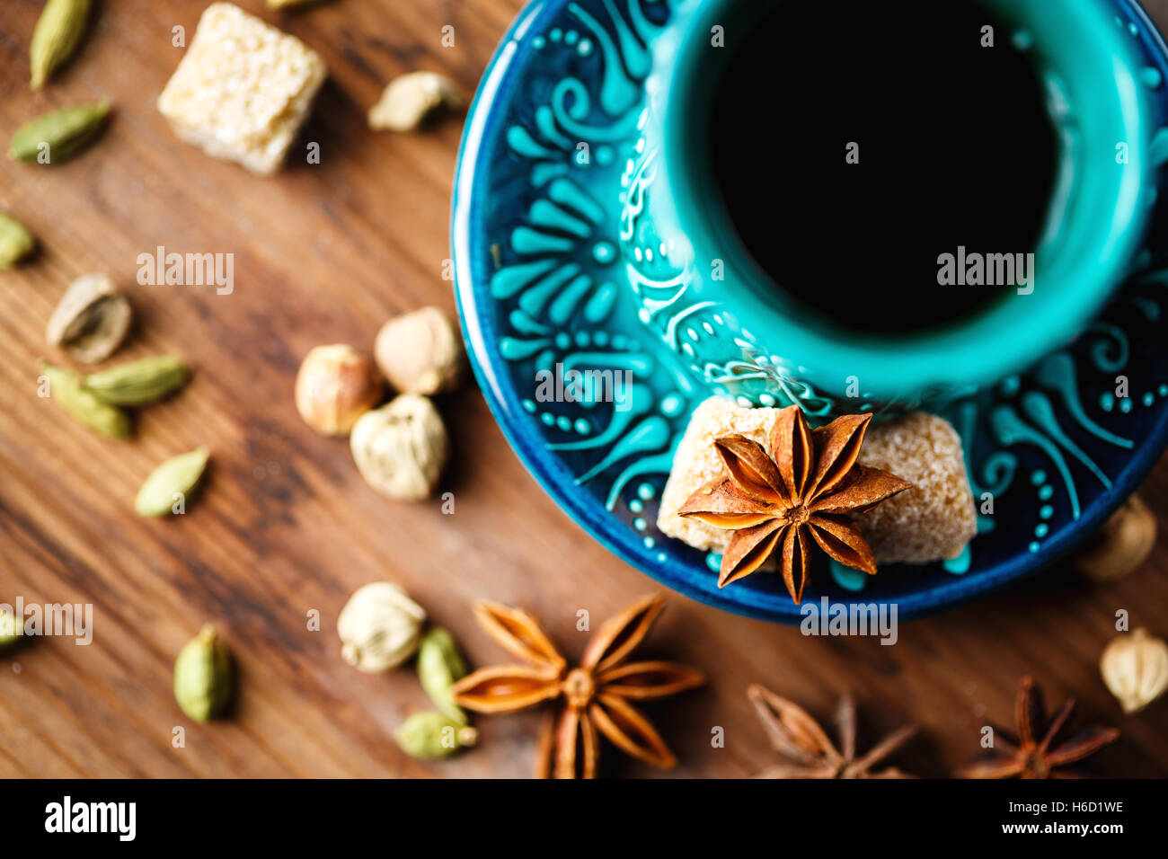 Hot drink with spices in authentic eastern arabic dish, masala chai or ...